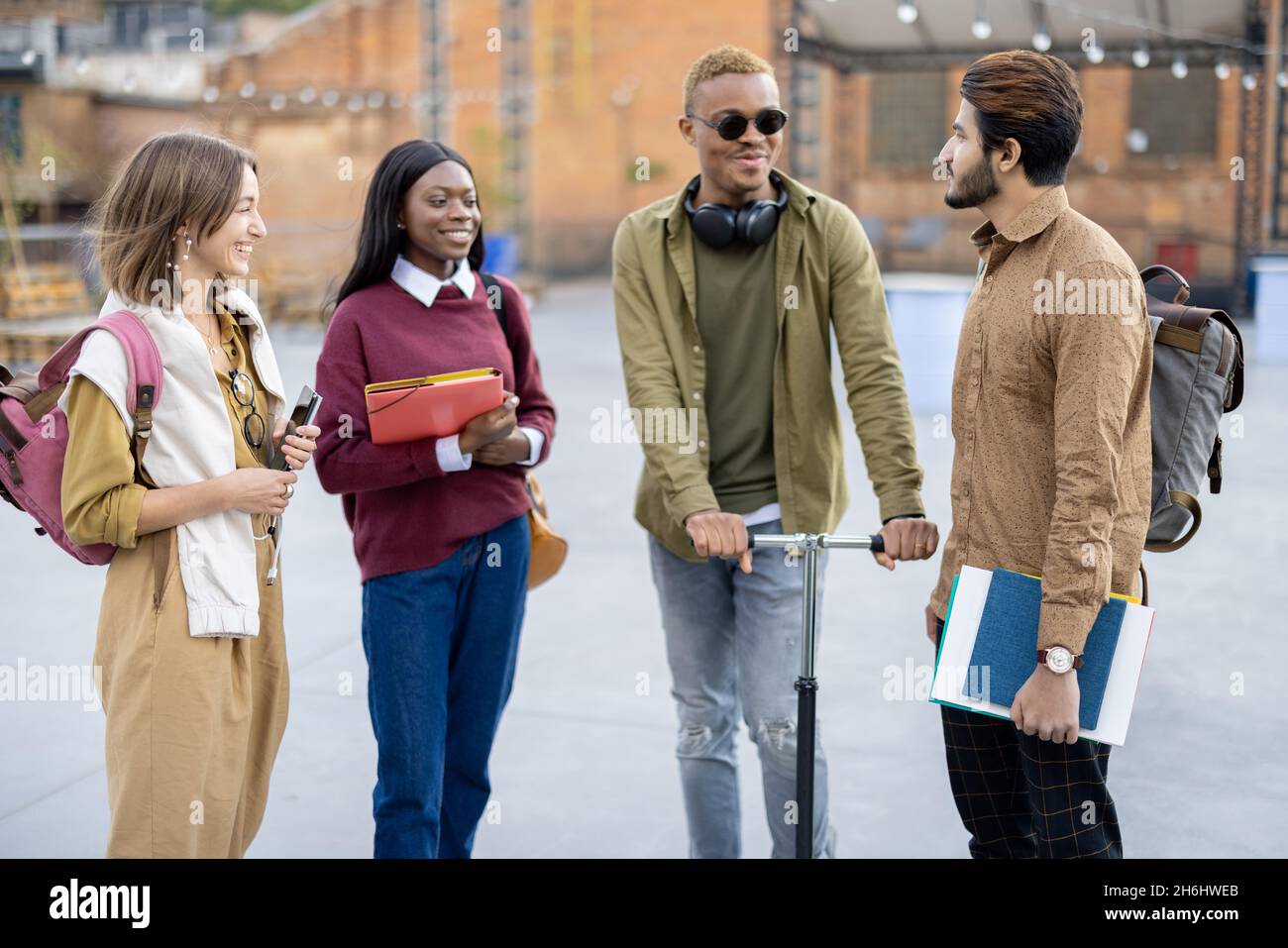 Students walk together at university campus Stock Photo - Alamy