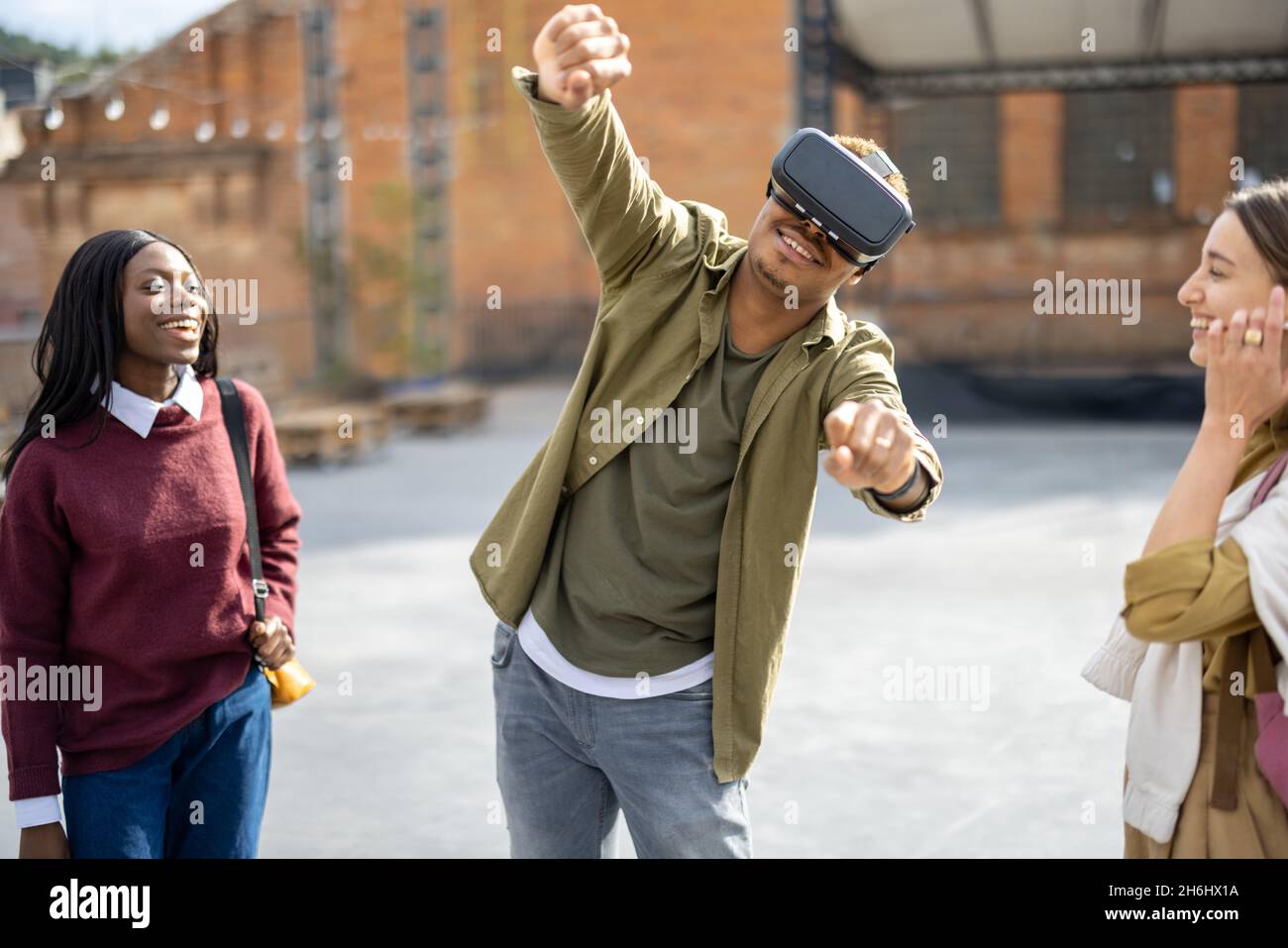 Mixed races students at university campus outdoors Stock Photo - Alamy
