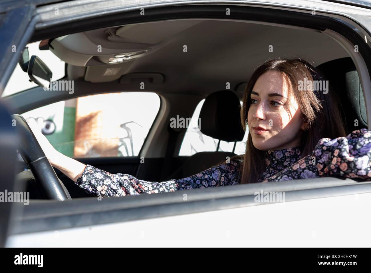 Adult brunette driving car hi-res stock photography and images - Alamy