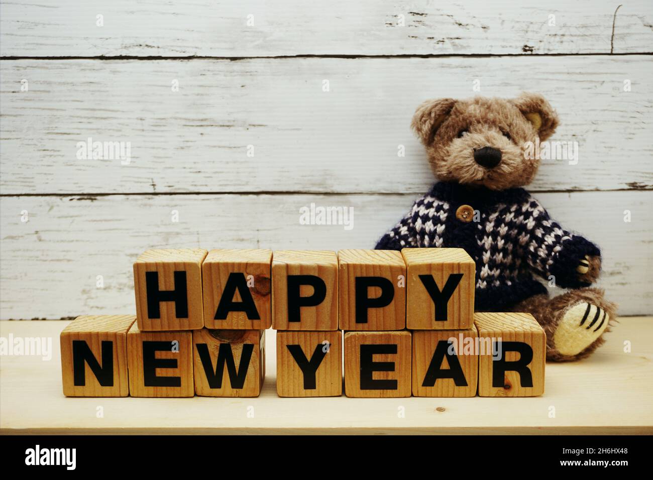 hapy new year alphabet letters on wooden background Stock Photo - Alamy