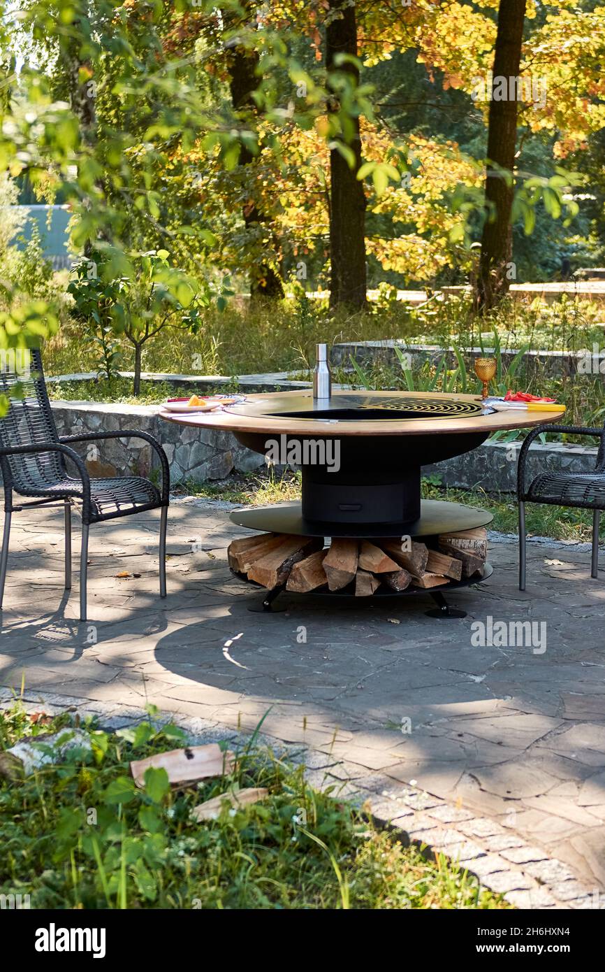 Kettle Grill Pit with Cast Iron Grid. Round table-cooking surface with ...