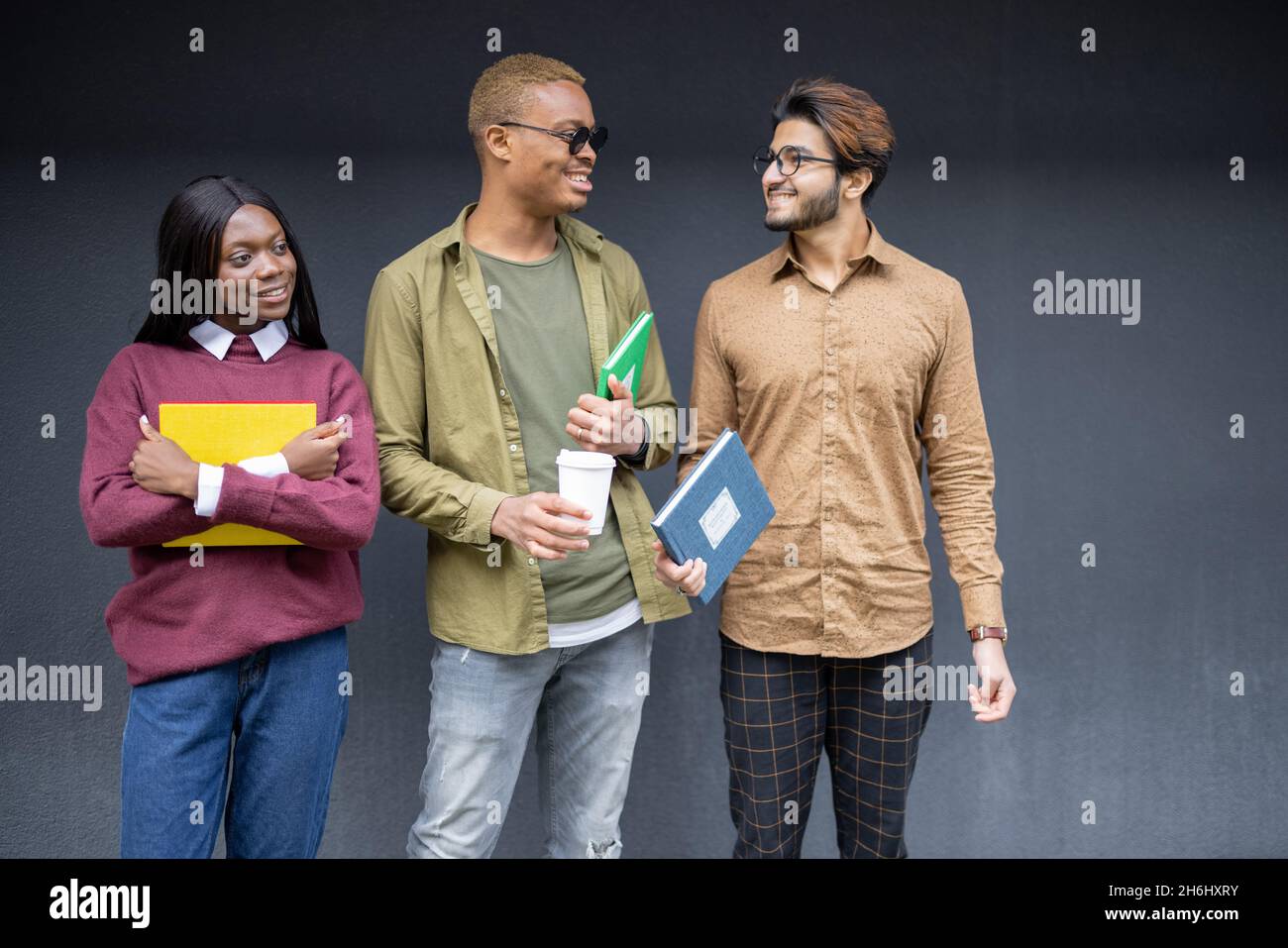 Multiracial students stand and look at camera Stock Photo - Alamy