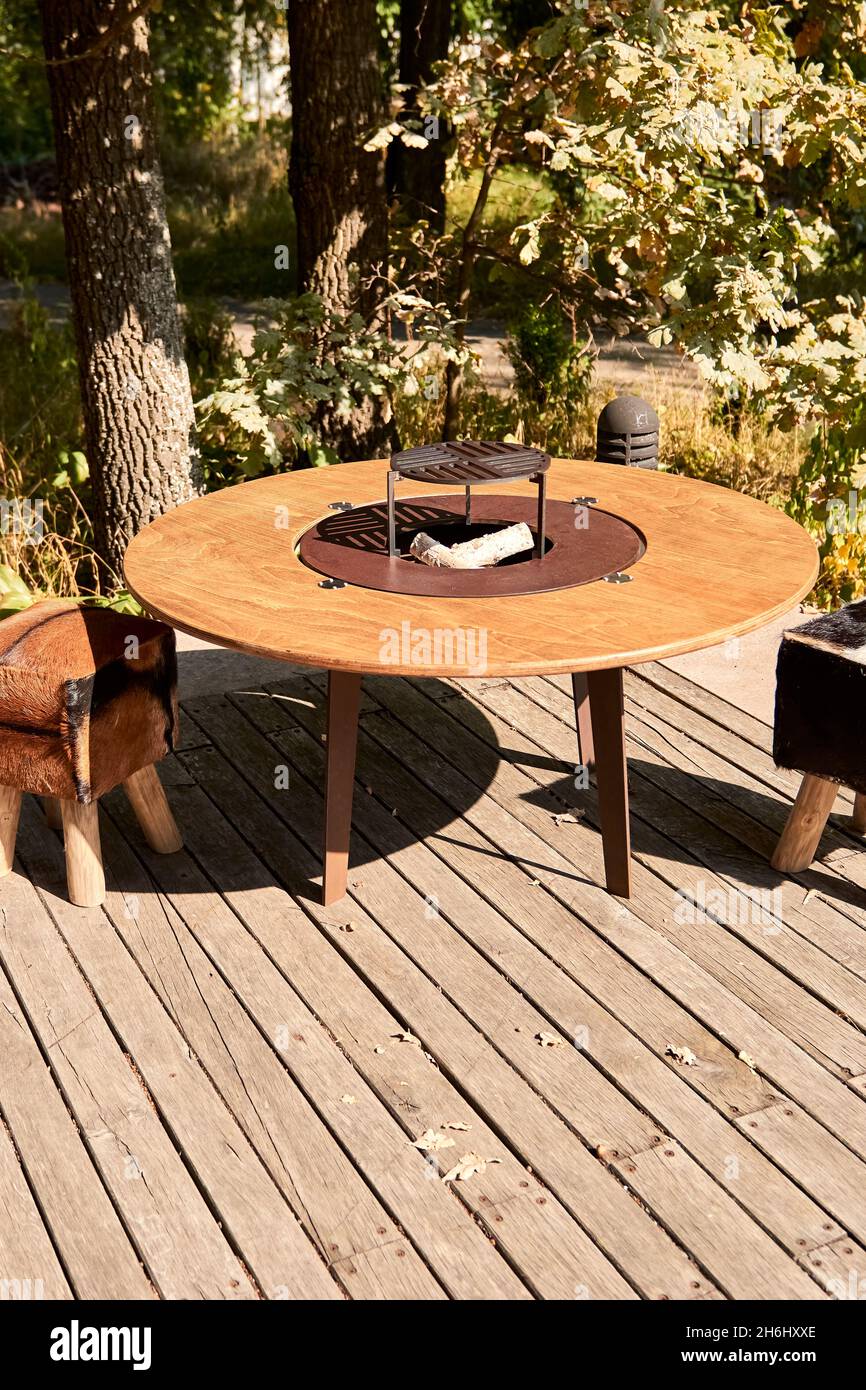Kettle Grill Pit with Cast Iron Grid. Round table-cooking surface with ...