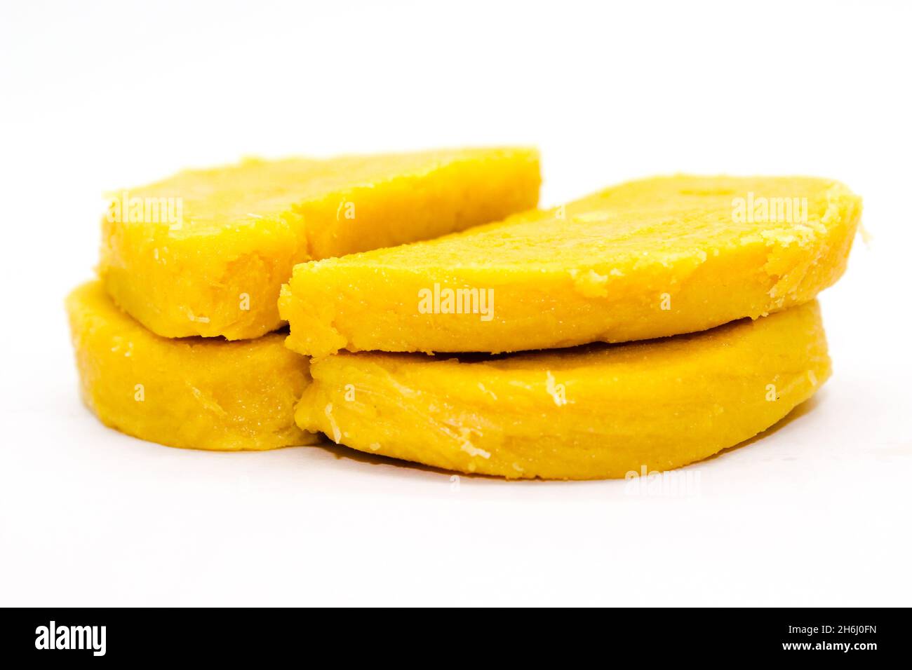 Gram flour sweets on white background with selective focus Stock Photo ...