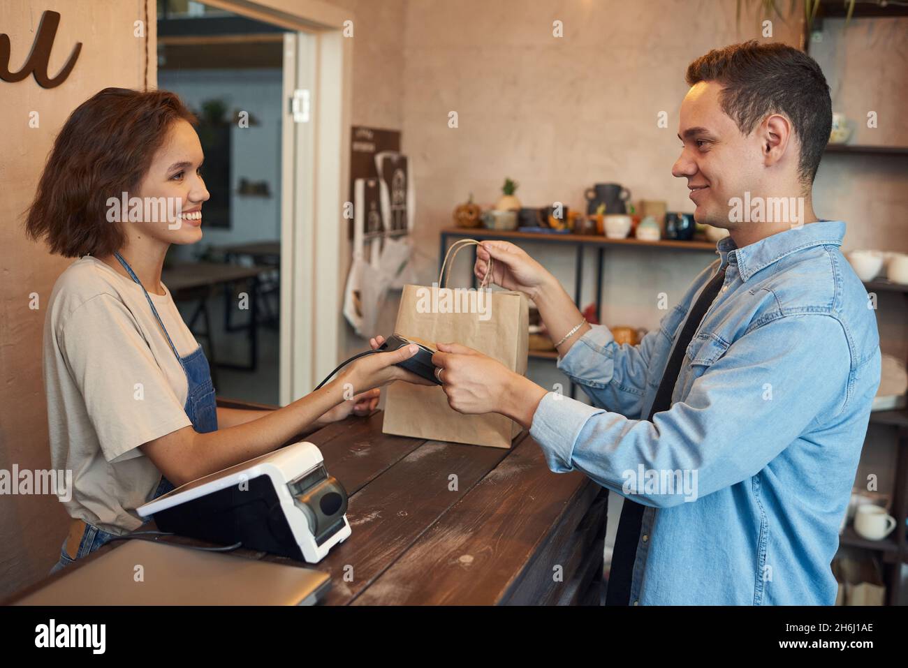 Woman shop counter hi-res stock photography and images - Alamy