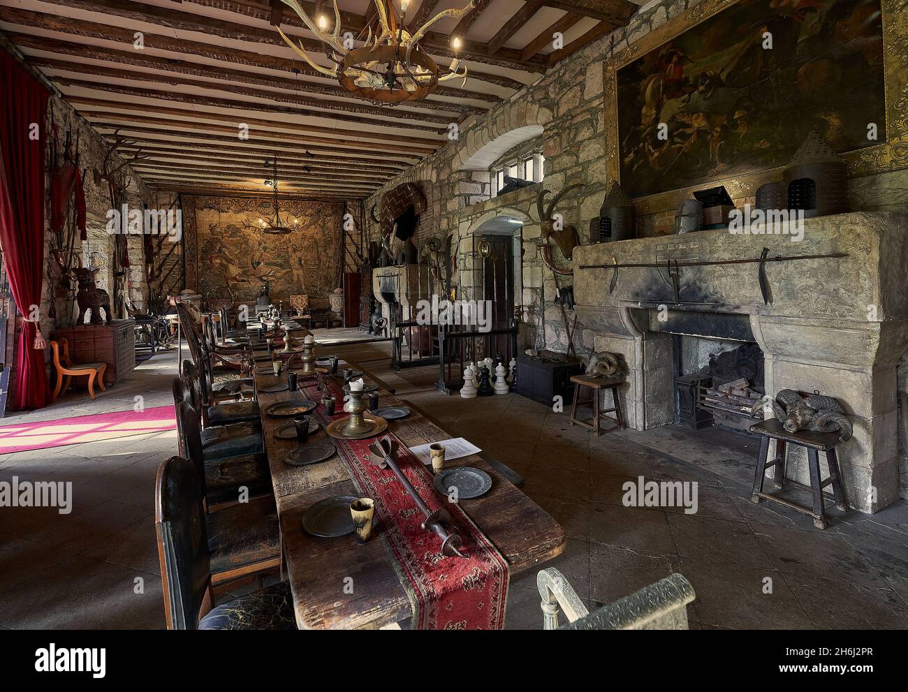 Ancient Historic castle dining room with stone fireplace Stock Photo ...