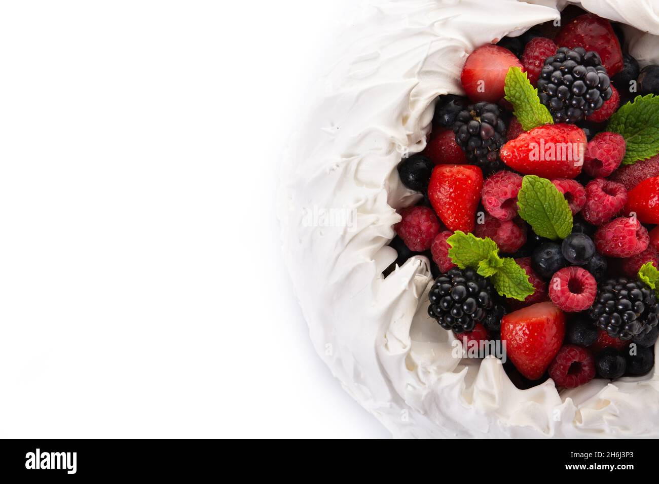 Delicious Pavlova cake with meringue topped and fresh berries isolated ...