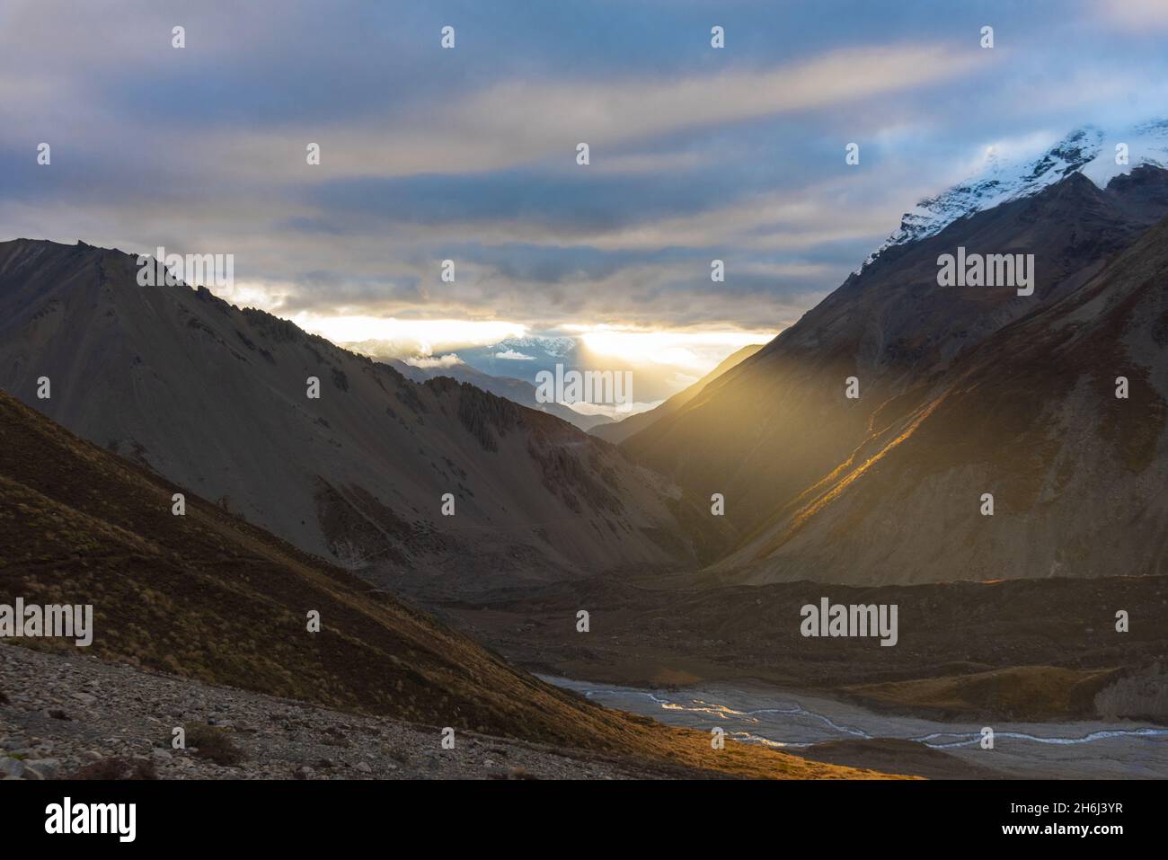 Snowy Tilicho Peak mountain in the Nepalese Himalayas under a blue ...