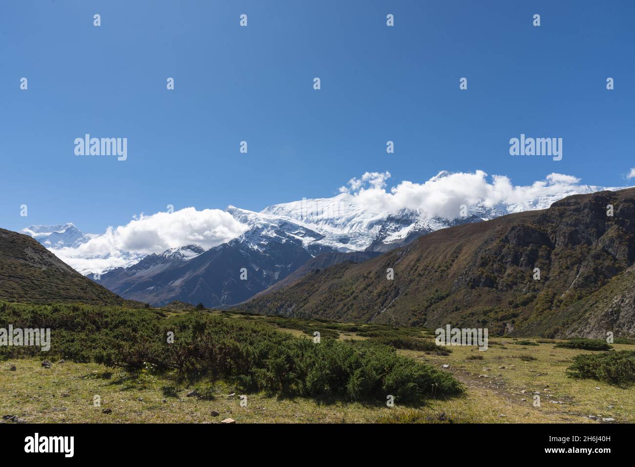 Beautiful shot of the Nepalese Himalayas snowy mountains under a blue ...
