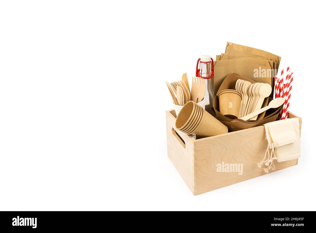 Wooden box with new fast food utensils. Disposable tableware set ...