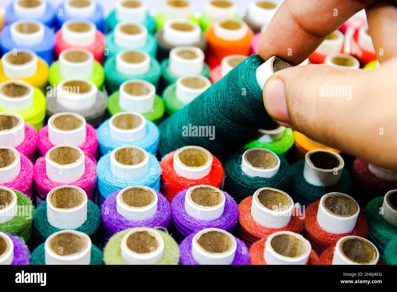 A picture of thread rolls with selective focus Stock Photo - Alamy