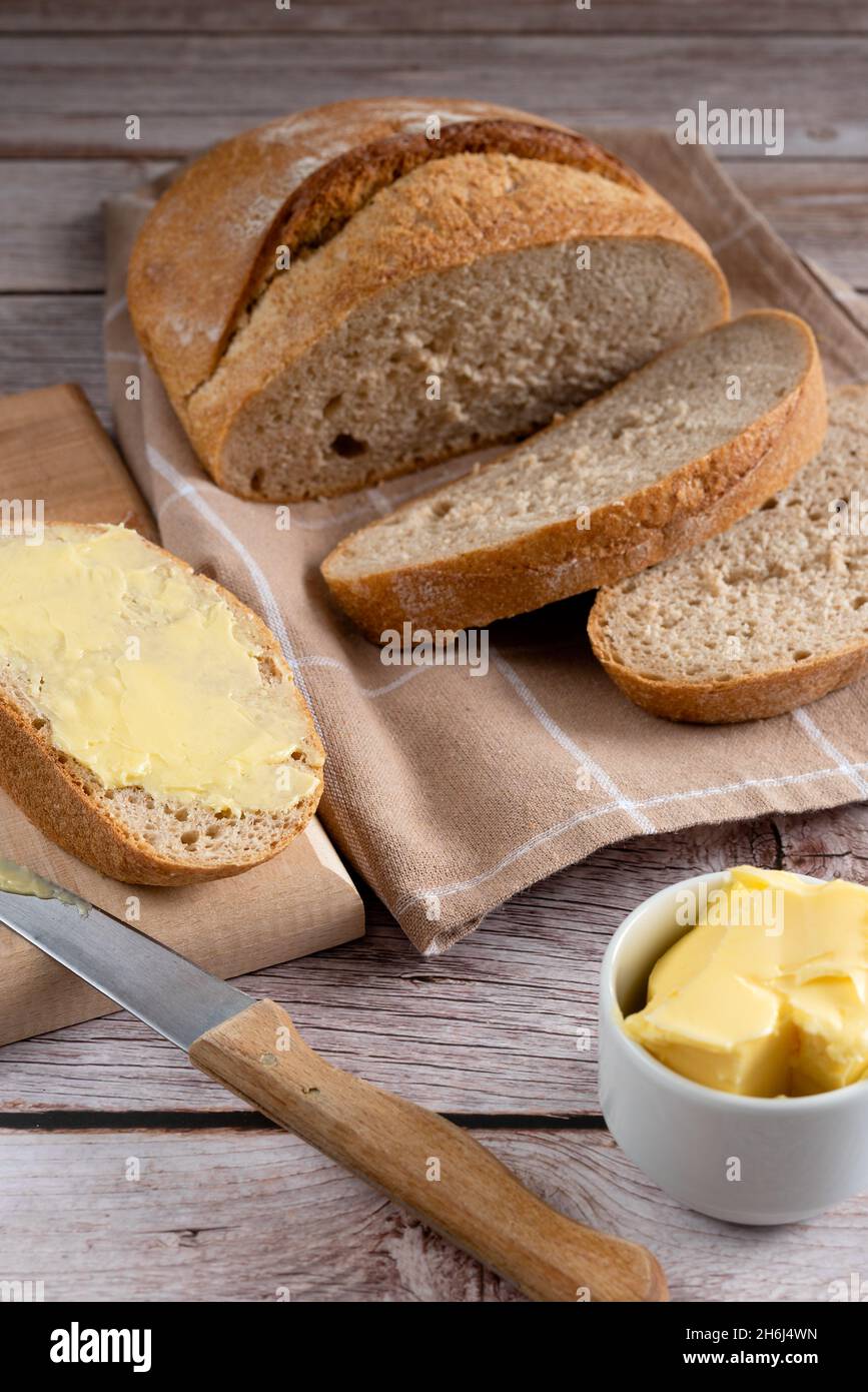 Healthy and delicious whole grain bread with butter. Vertical shot ...