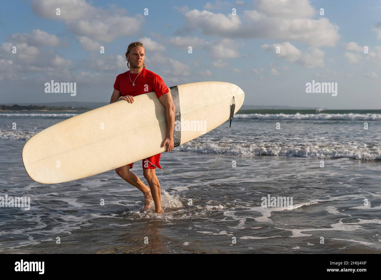 surfer man in red portrait with surfboard. bali Stock Photo - Alamy