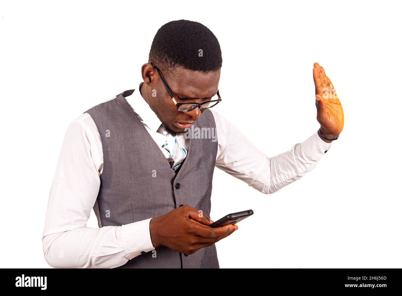 handsome young surprised businessman wearing a gray suit vest and ...