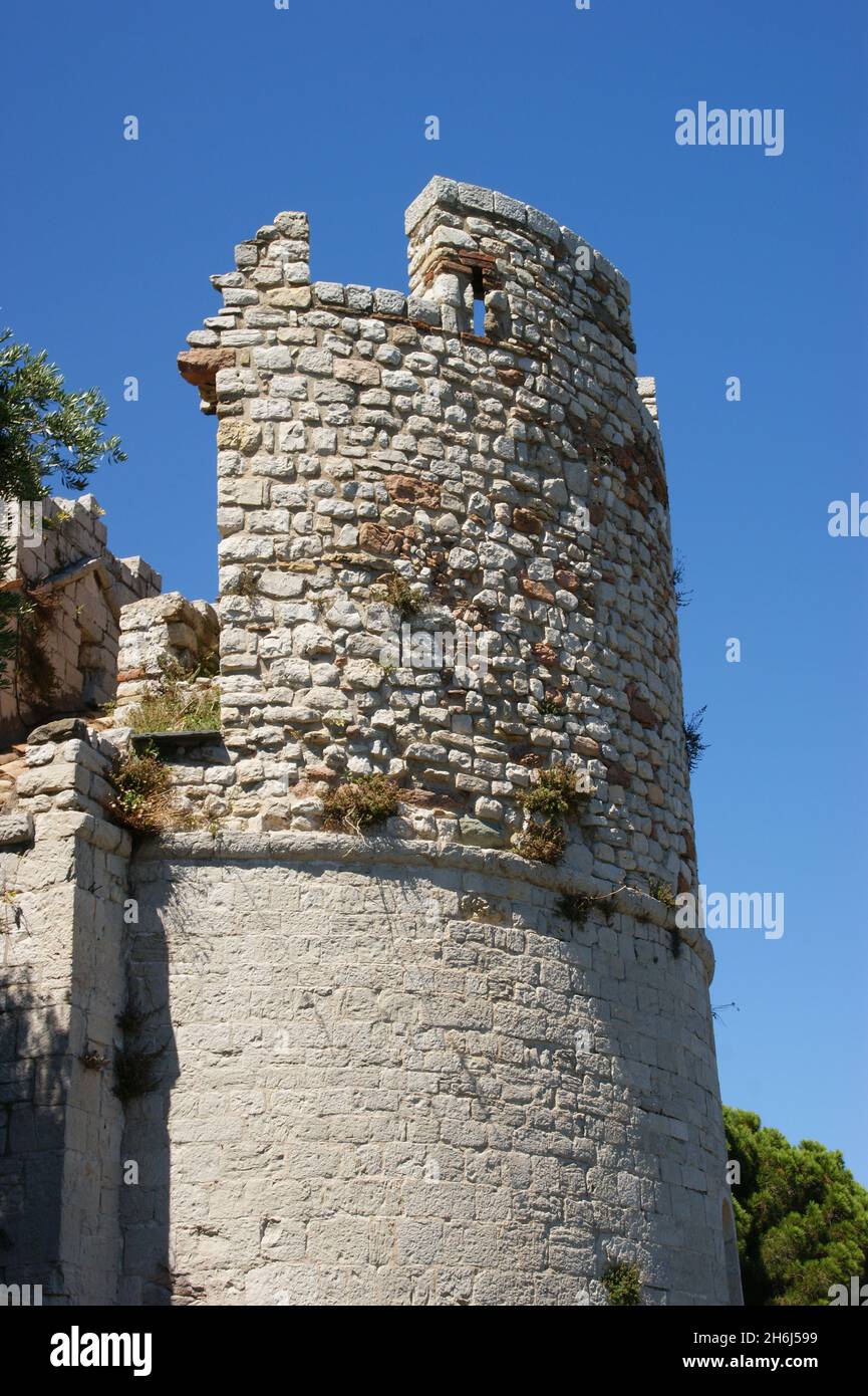 CANNES, FRANCE - Aug 08, 2011: A damaged stone wall of the castle tower ...
