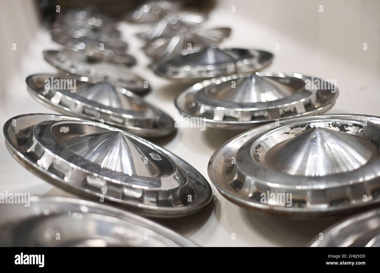 Closeup shot of shiny metal chrome hubcaps Stock Photo - Alamy