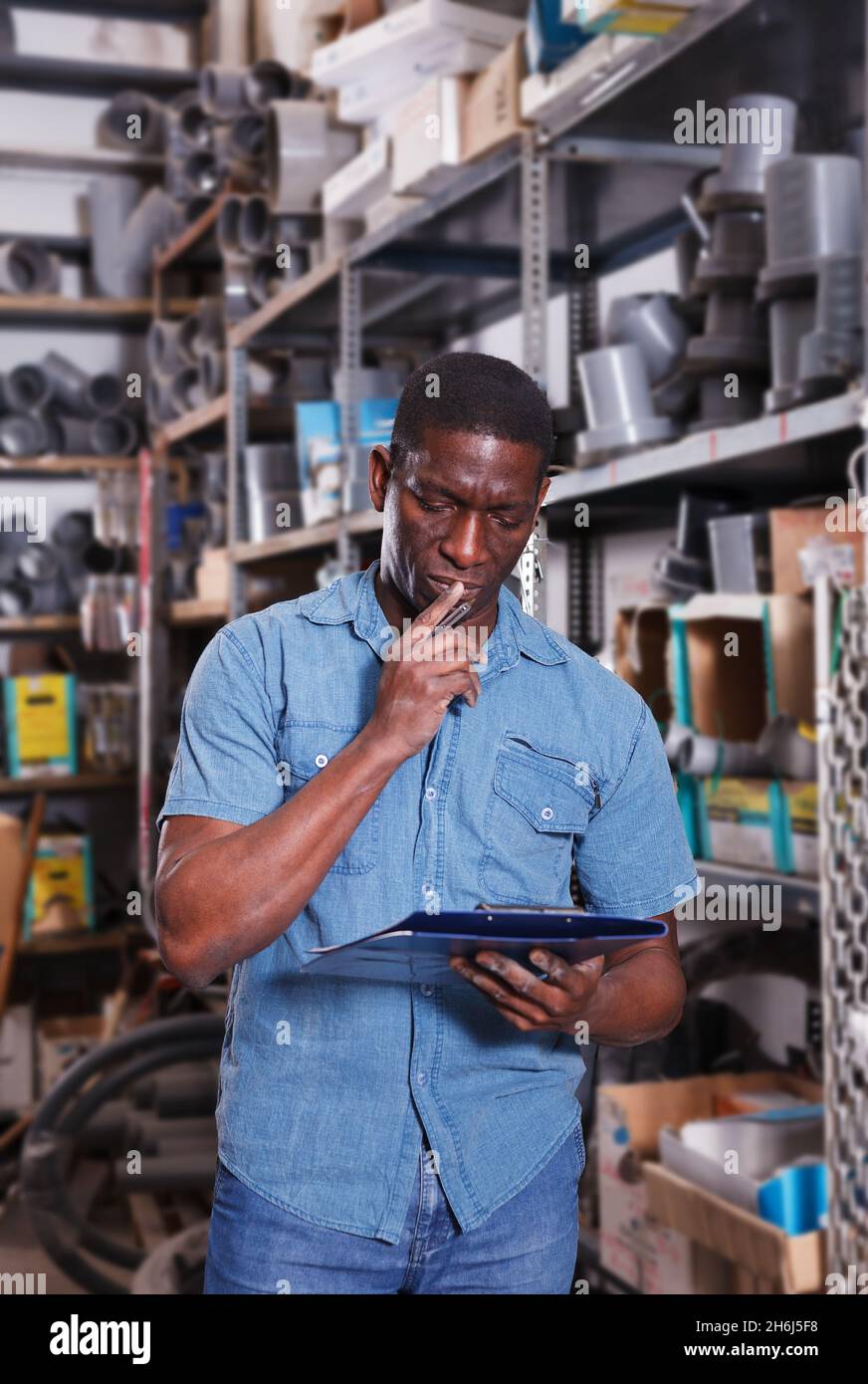 Worker taking inventory in store Stock Photo - Alamy