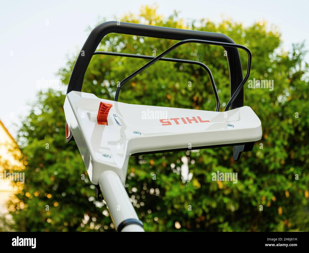 low angle view of new lawn mower handle with multiple buttons with ... low angle view of new lawn mower handle with multiple buttons with ...