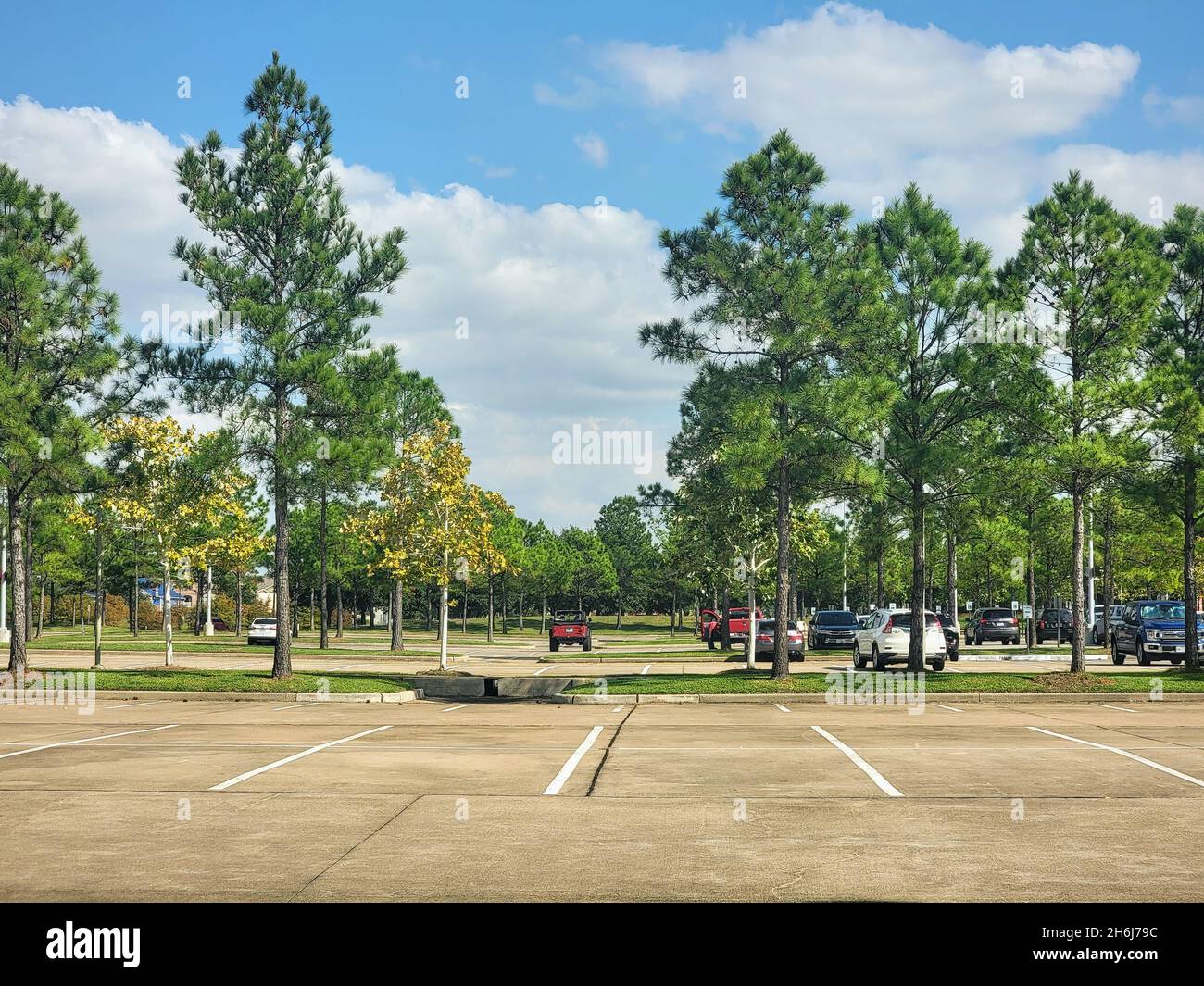 Landscape view of a city street and a parking area with cars Stock ...