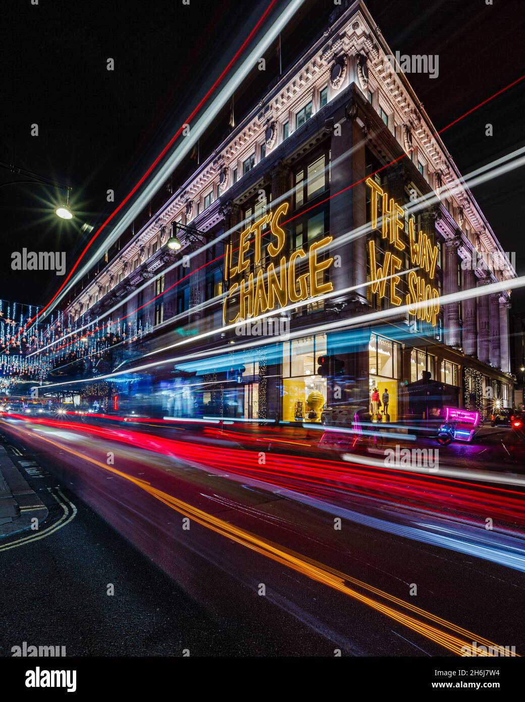 Light trails pass by Selfridges in London Stock Photo - Alamy