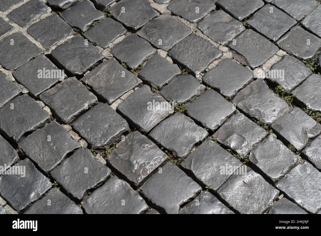 Sampietrini stone pavel road in rome Italy Stock Photo - Alamy