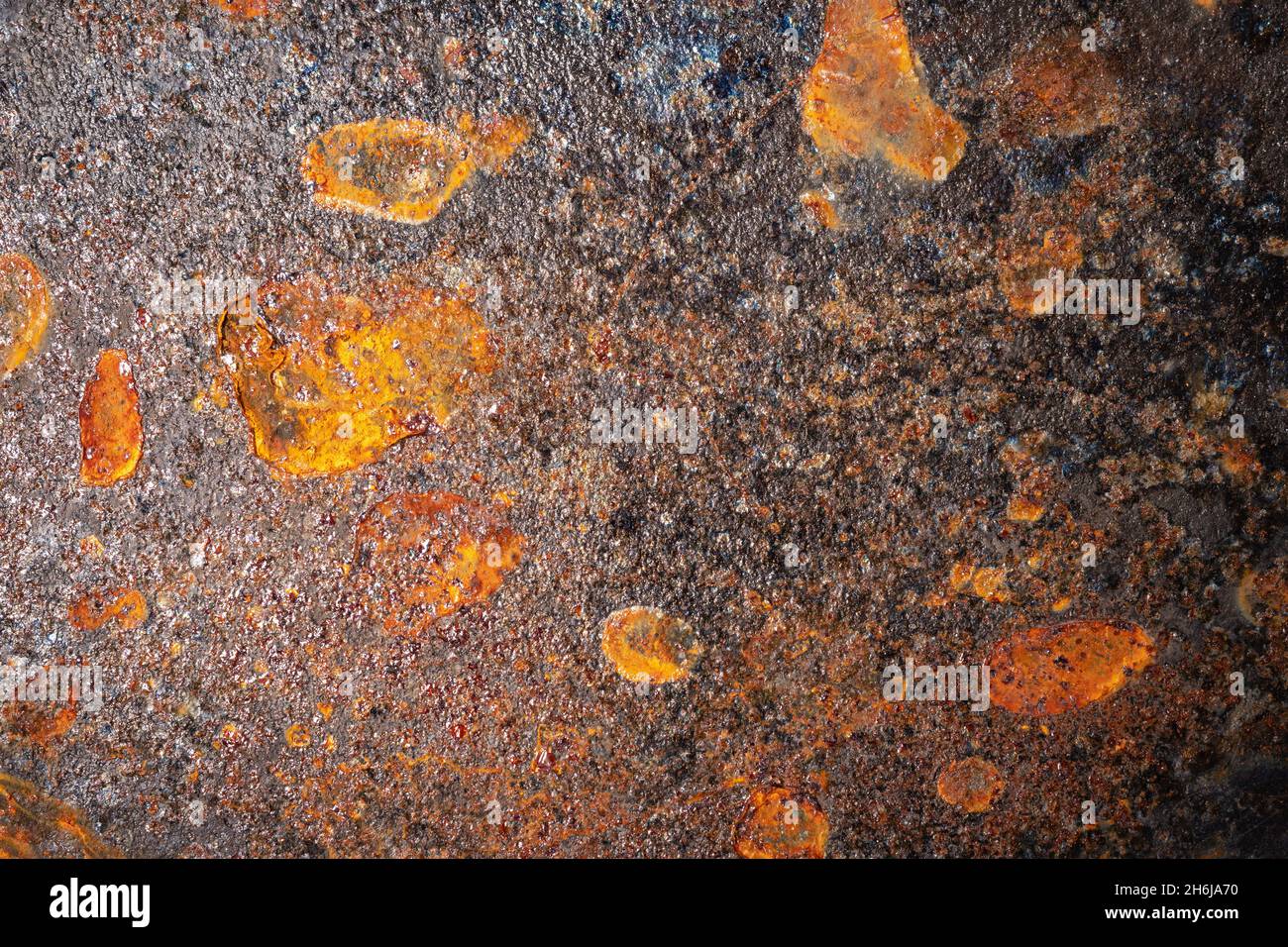 Abstract texture of the surface of a cast iron pan with rust elements ...