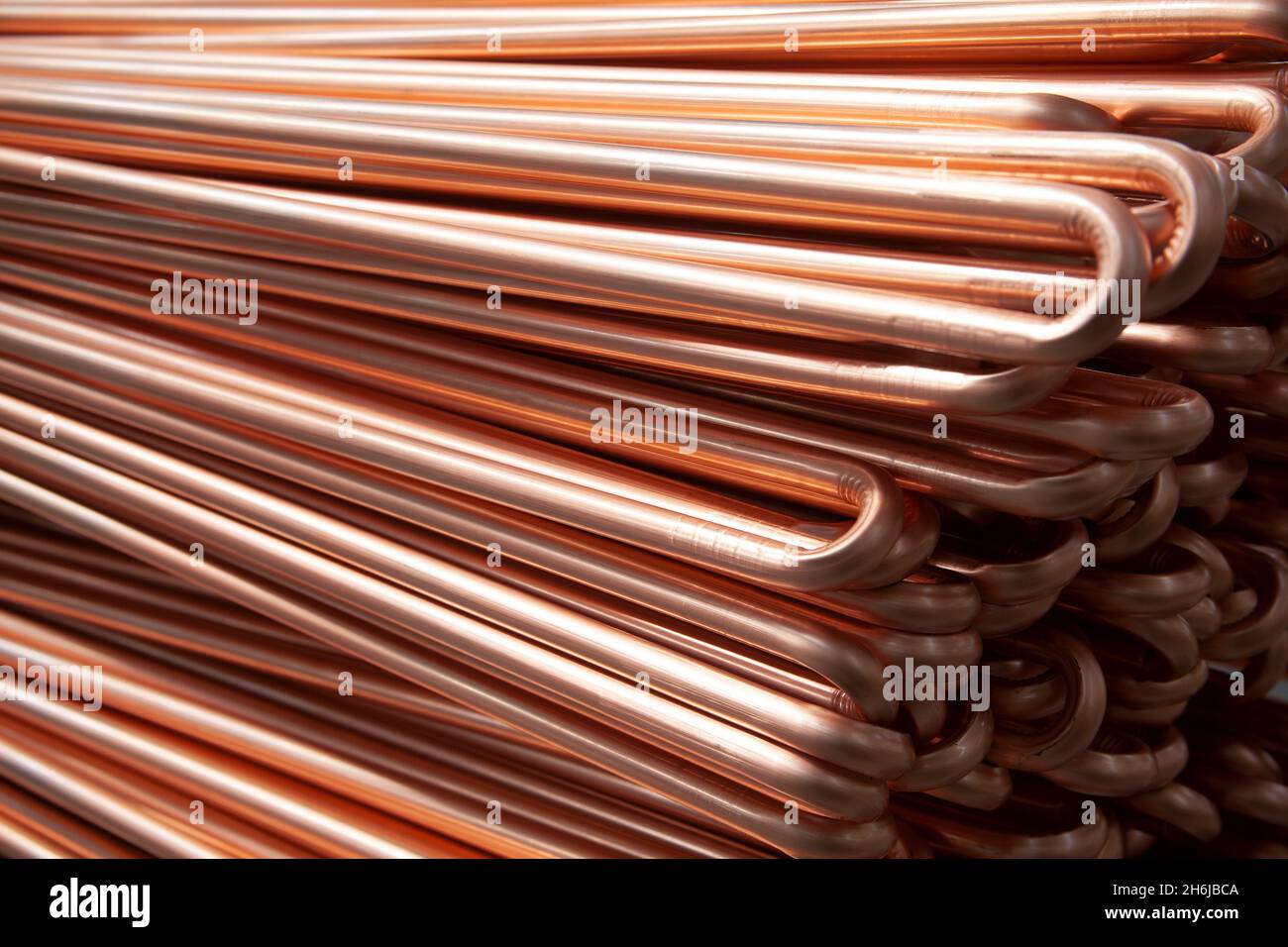 Copper pipes in factory, industrial background Stock Photo - Alamy