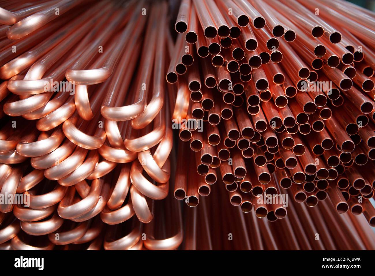 Copper pipes in factory, industrial background Stock Photo - Alamy