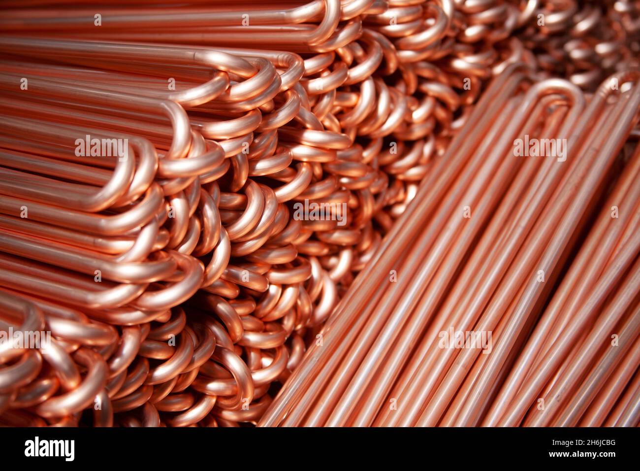 Copper pipes in factory, industrial background Stock Photo - Alamy