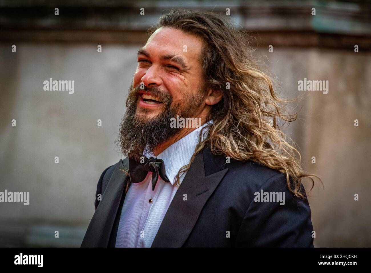 Jason Momoa Smiling and laughing on the red carpet at the James bond No ...