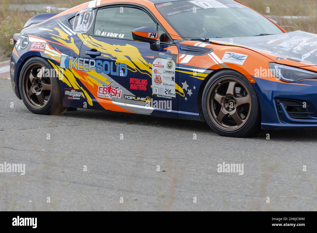 The Subaru BRZ sports car drives down the road at high speed. Side view ...