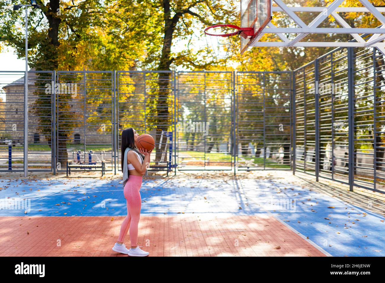 Female basketball player getting ready to make a ball throw to the ...