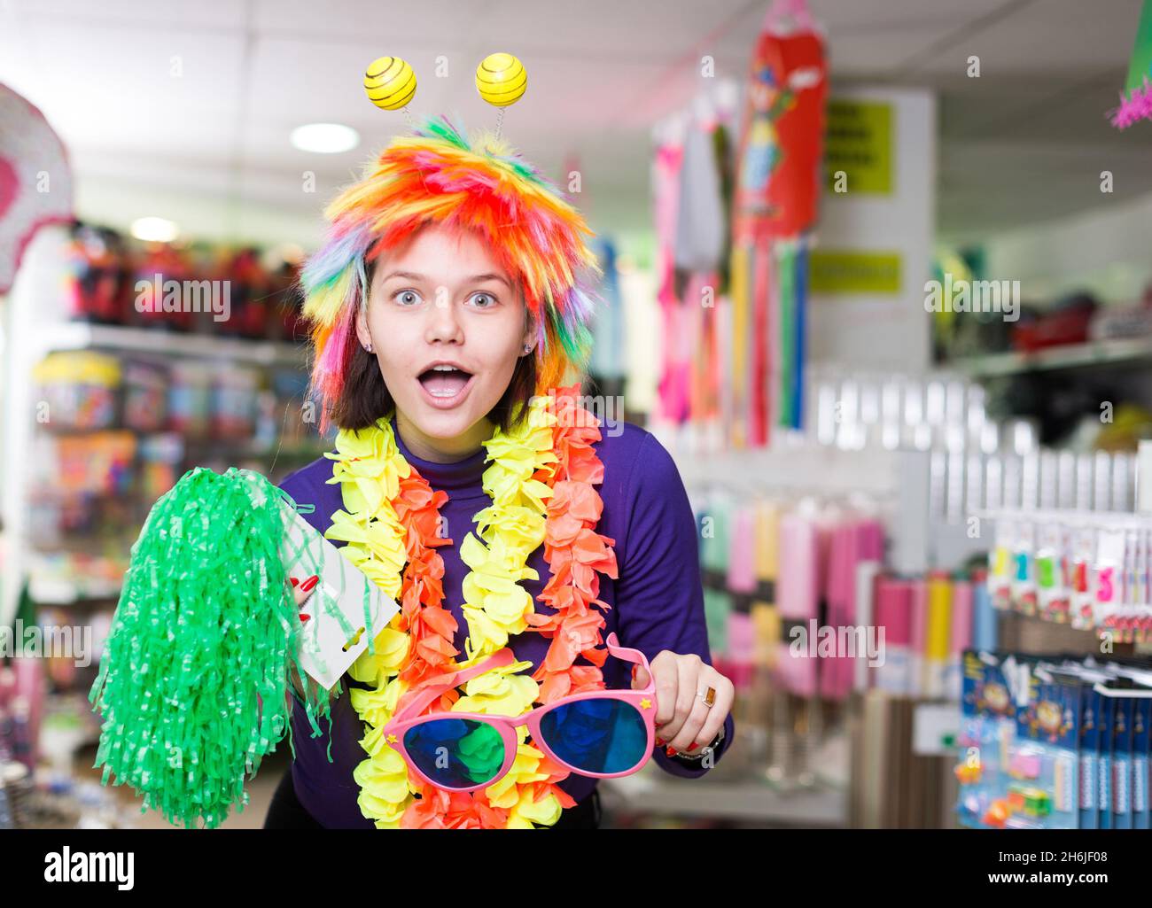 Female having fun in festival outfits store Stock Photo - Alamy