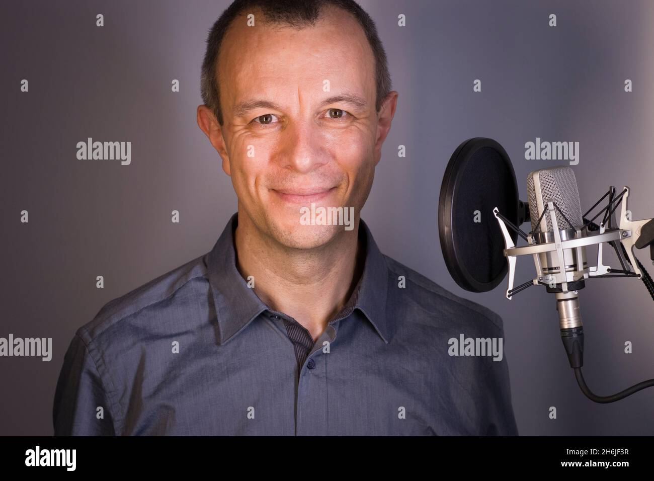 Voice over artist in booth hi-res stock photography and images - Alamy