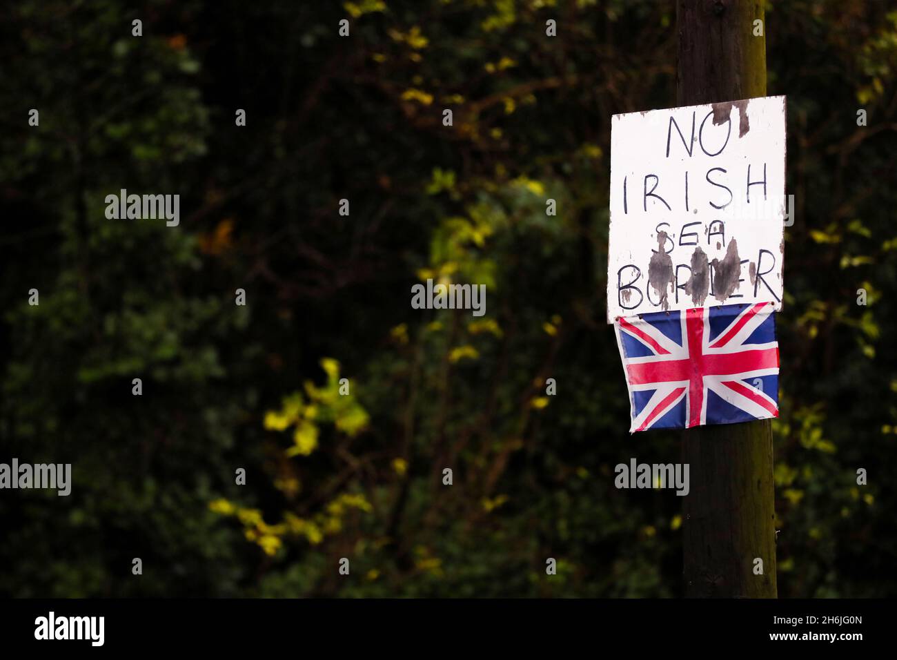 Anti Irish Sea Border placard and small Union Flag attached to a ...