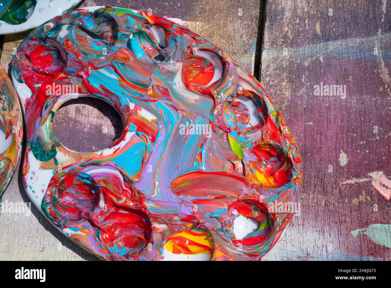 paint palettes smeared with multi colours of paint Stock Photo - Alamy