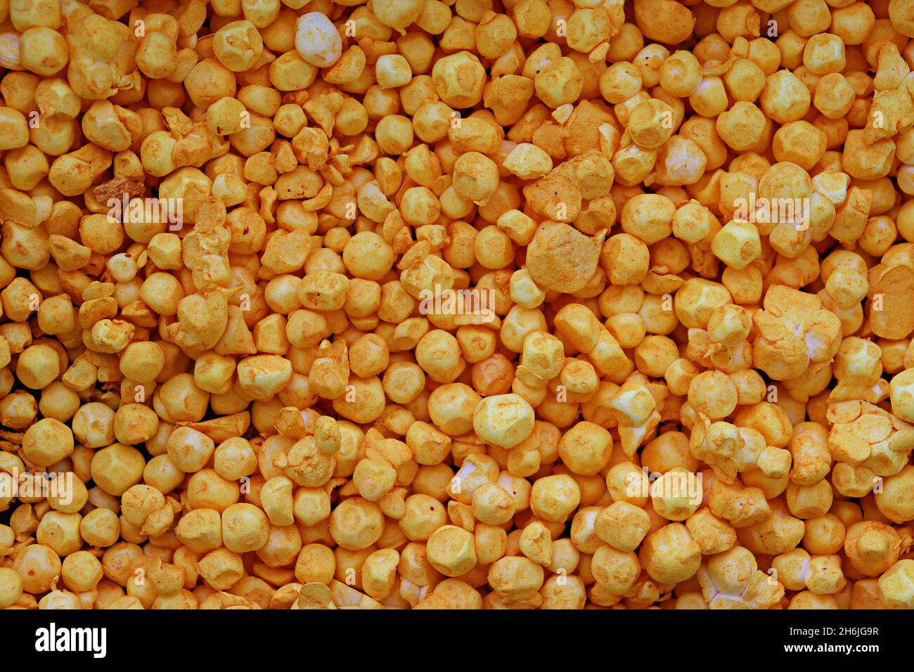 Polystyrene balls colored in orange, forming a background texture that ...