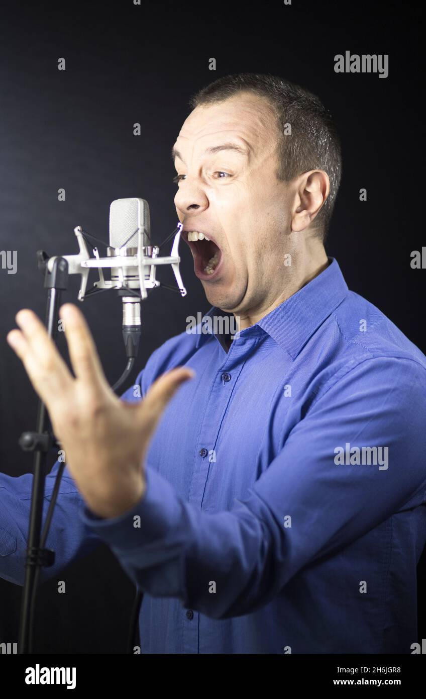 Voice over artist in booth hi-res stock photography and images - Alamy
