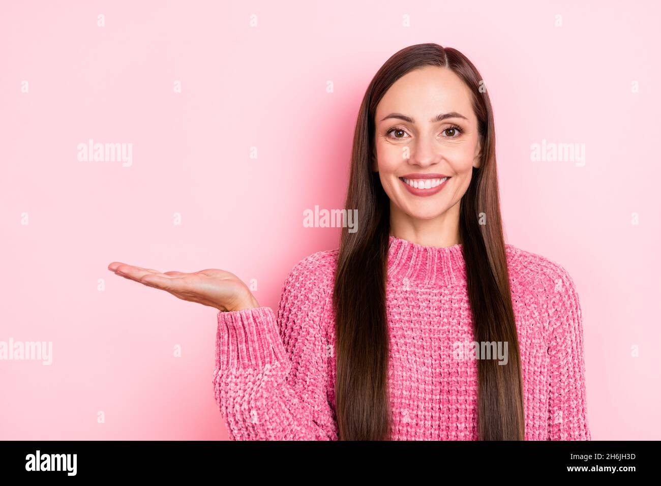 Photo of nice mature lady hold empty space wear pink sweater isolated ...