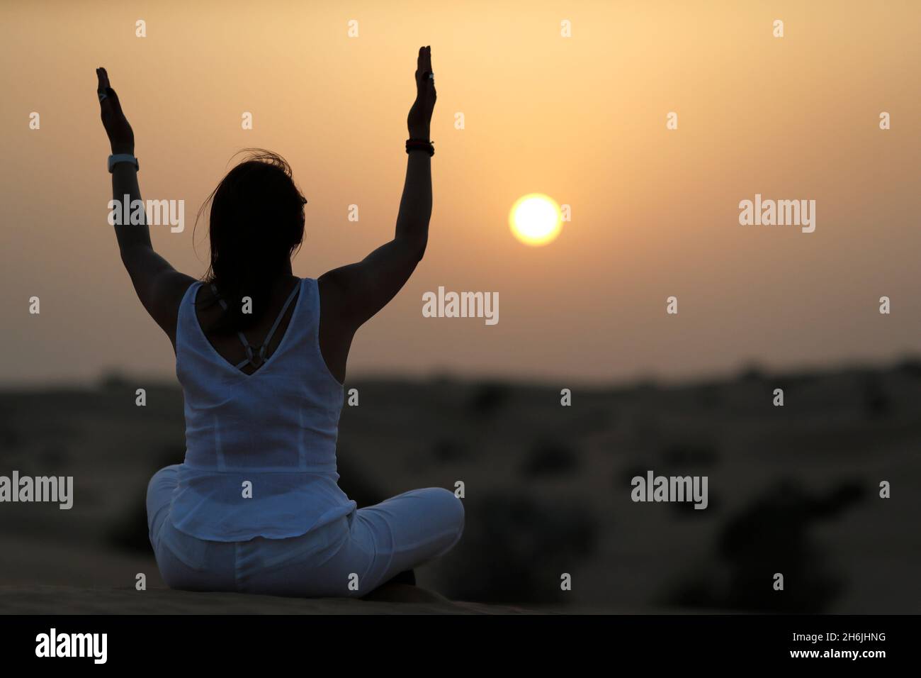 Sunset meditation in the desert at sunset, as concept for religion ...