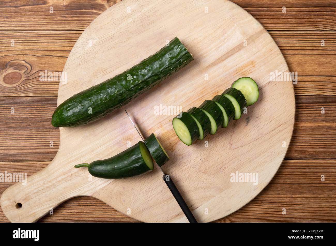 Cutting fresh cucumber hi-res stock photography and images - Alamy