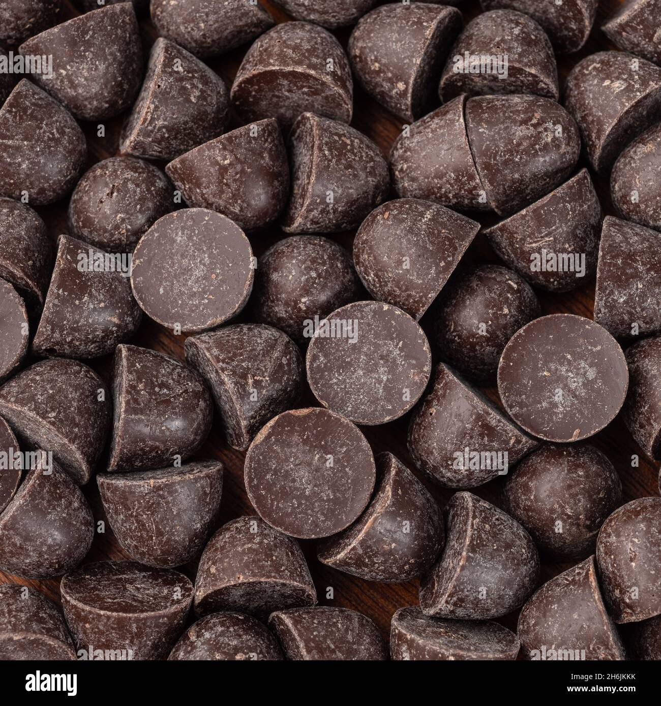Closeup, top view of dark chocolate chips. Food backdrop Stock Photo ...