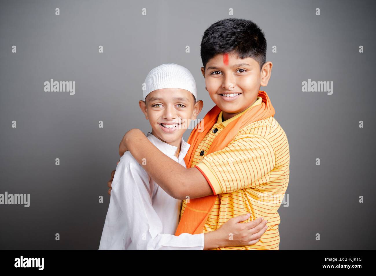 Happy Hindu Muslim Children Hugging Each Other and looking camera with ...