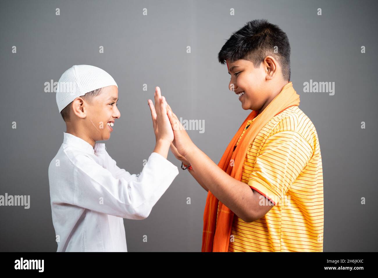 Happy Hindu muslim multiethnic kids by playing by clapping hands ...