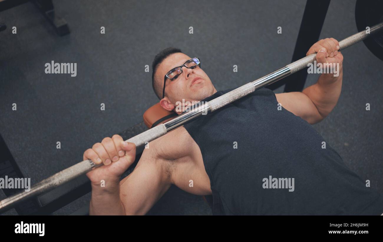 An Arab man pumps his chest in the gym Stock Photo - Alamy