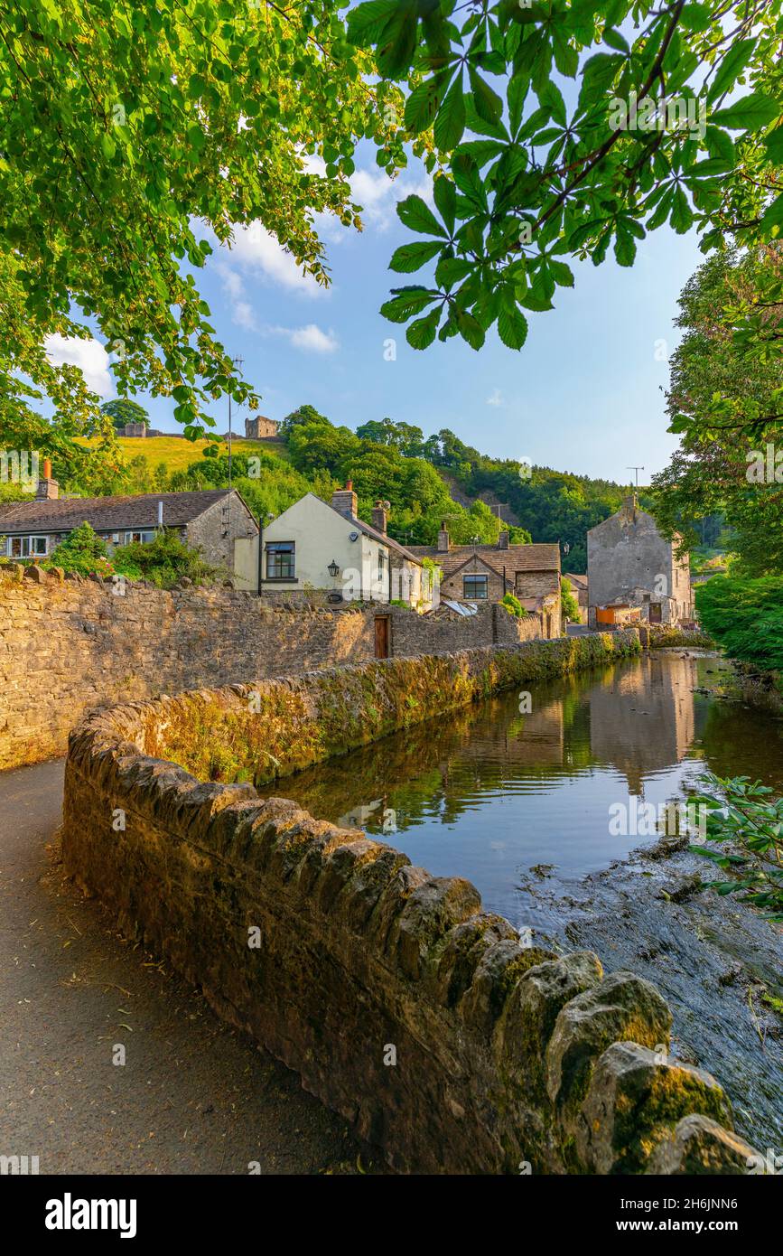 View of Castleton village and stream overlooked by Peveril Castle, Hope ...
