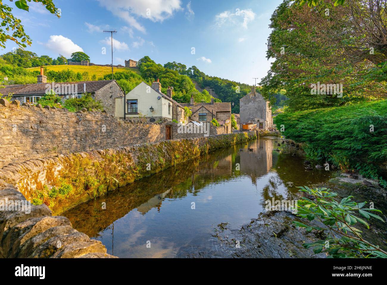 View of Castleton village and stream overlooked by Peveril Castle, Hope ...