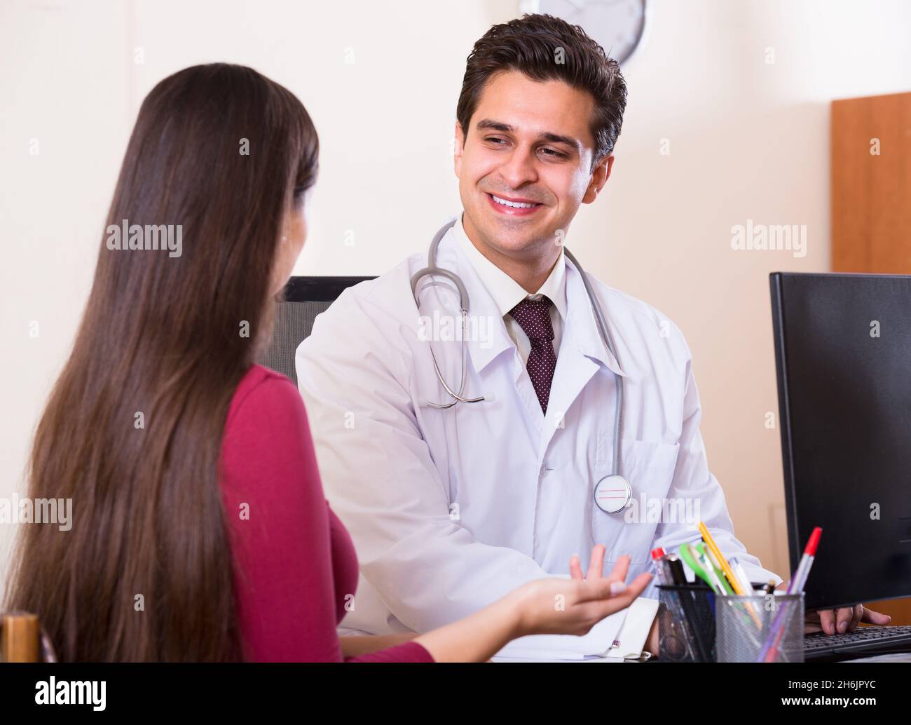 doctor receiving ill patient Stock Photo - Alamy