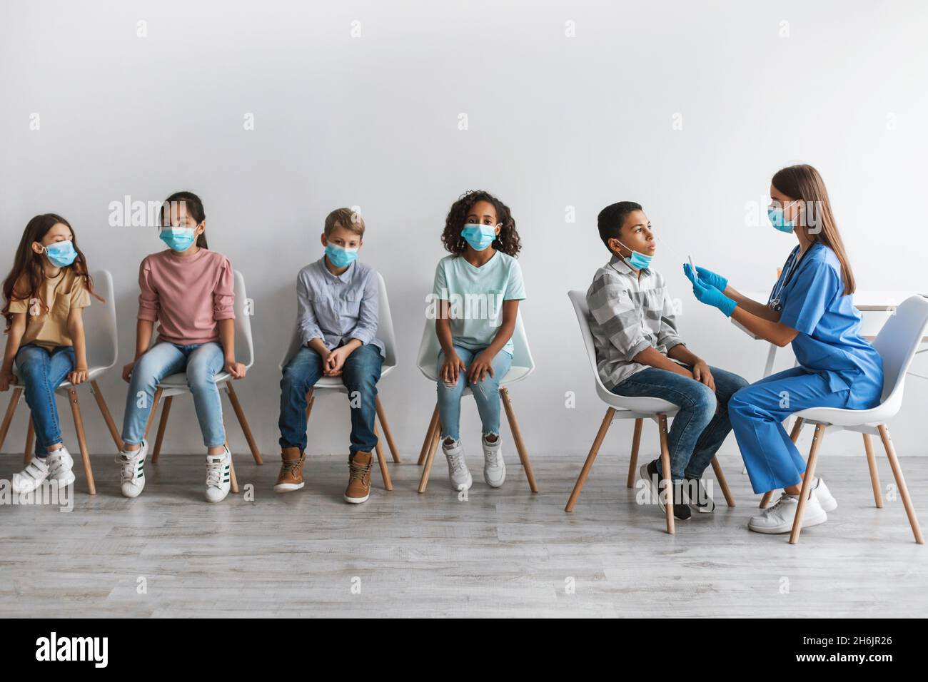 Nurse Making PCR Test For Boy Testing Children Group Indoor Stock Photo ...