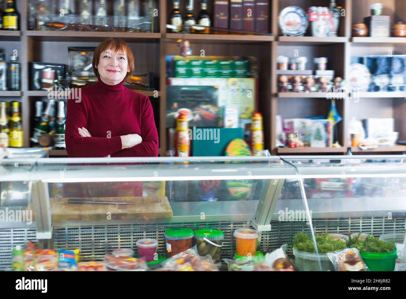 Mature woman working supermarket hi-res stock photography and images ...